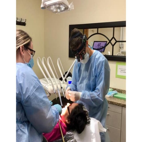 Dr Greg Gillespie fixing dental crown at Gillespie Dentistry | PDF