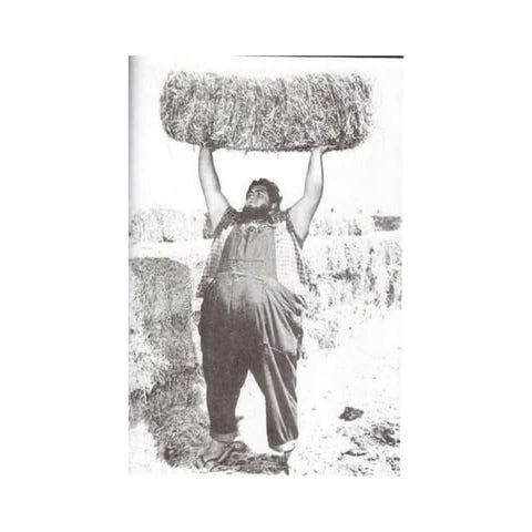 Haystack Calhoun sported a trademark white T-shirt, blue overalls, and ...