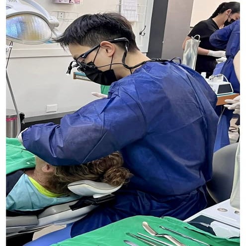 Seattle dentist Dr Harrry Shin placing implants for patients in need in ...